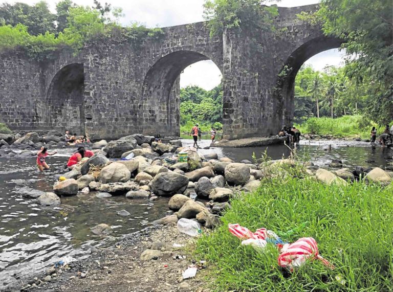 Vandals deface cultural treasure Malagonlong Bridge in Tayabas ...